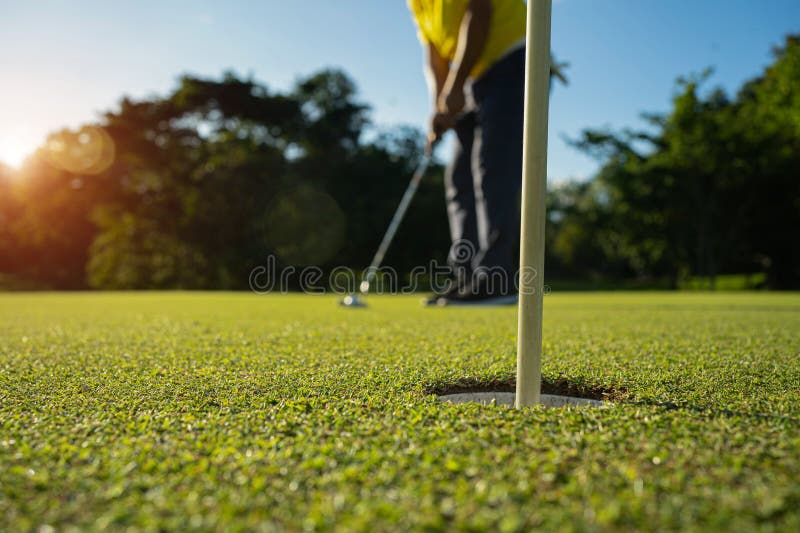 Blurred Golfer Playing Golf in the Evening Golf Course, on Sun Set ...