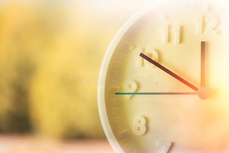 Blurred Green Background and Close Up of Clock. Double Exposure Stock ...