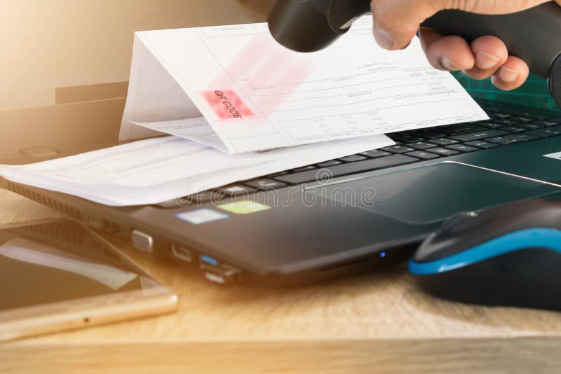 Blurred Image Hand Holding Barcode Reader Focus To QR Code on Paper ...