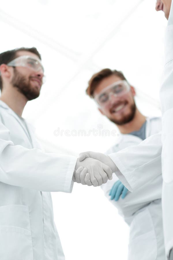 Blurred Image of a Handshake between Scientists Stock Image - Image of ...
