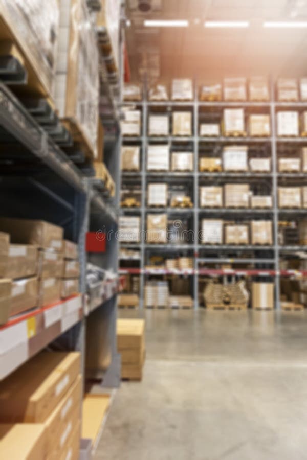 A Blurred Image of a Warehouse Full of Empty Cardboard Boxes Stacked on ...