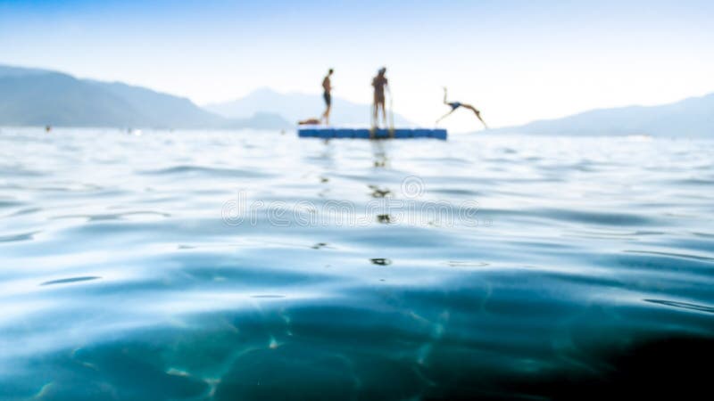Jumping into the Sea from the Pontoon. Stock Image - Image of seaside ...