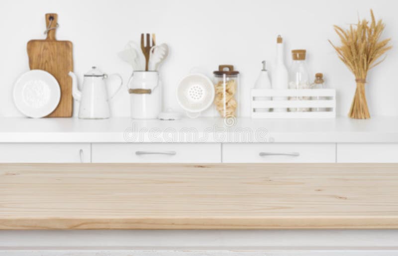 Blurred Kitchen Counter with Utensils and Ingredients Over Wooden Table ...