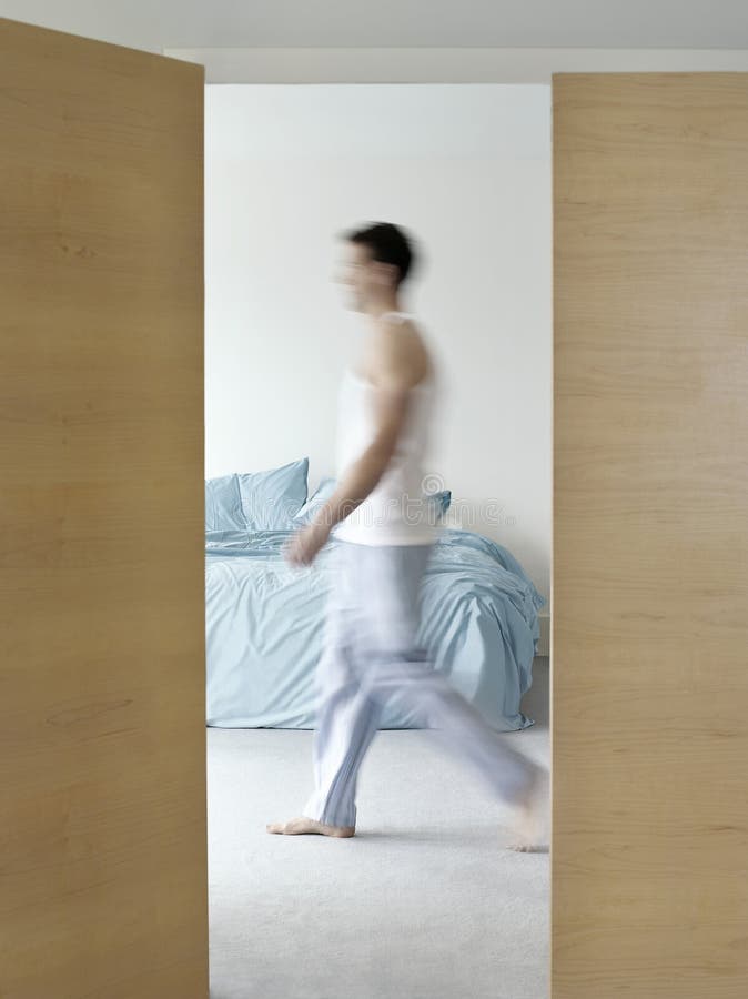 Blurred Man Walking in Bedroom Stock Photo - Image of profile, blurred ...