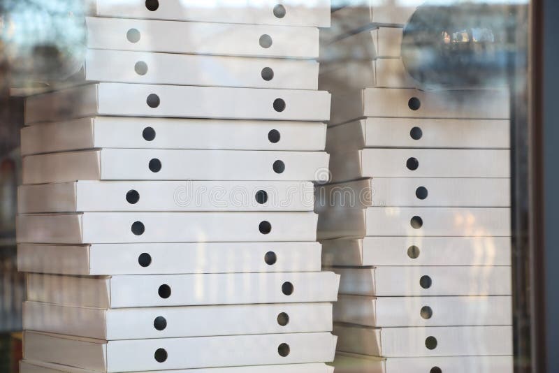 Blurred Many White Boxes in the Window of a Pizza Delivery Service ...