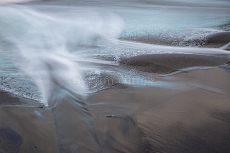 Blurred Motion Sea Water Flowing Over Brown Sand Stock Image - Image of ...