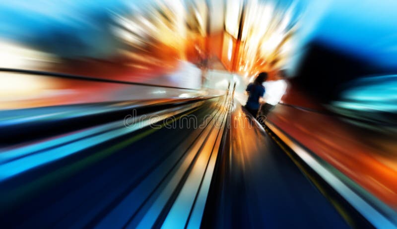 Blurred Motion of Two People in Escalator Stock Image - Image of people ...