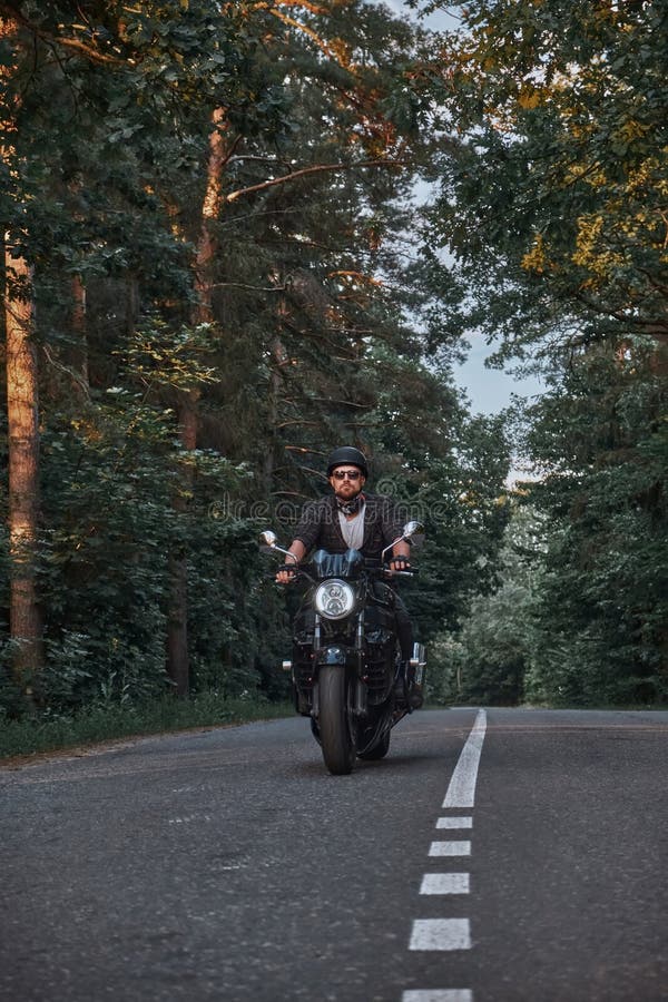 Blurred Motion a Young Man Biker in a Helmet Quickly Rides at High ...