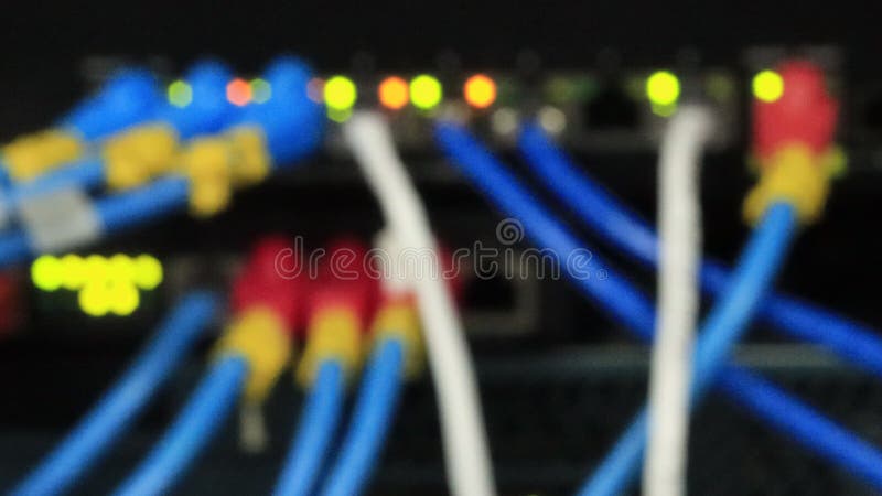 Blurred Network Hub with LAN Cable Connected To Patch Cables Connected ...