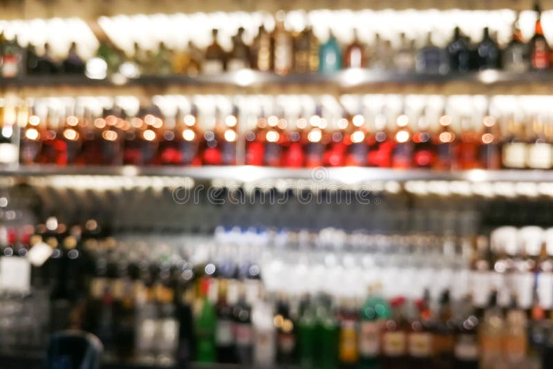 Blurred Bar Counter in Pub with Drinks and Stools Stock Image - Image ...