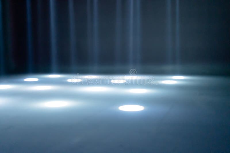 Blurred Rays of Light on Disco Floor. White Blue Neon Searchlight ...