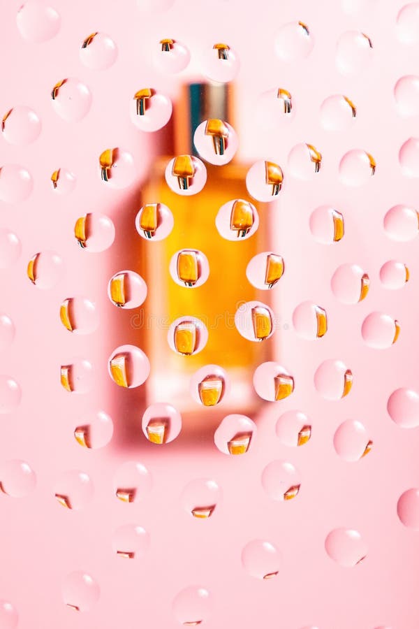 Blurred Rectangular Bottle of Perfume on Pink Background. Close Up ...