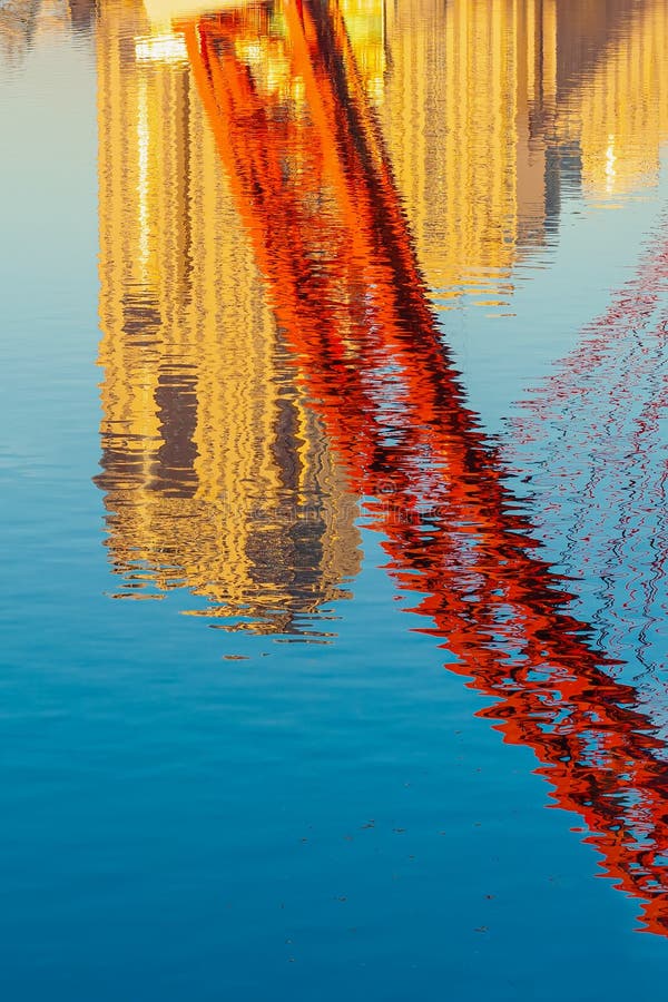 Blurred Reflection of Bright Bridge and Skyscraper in Water. Abstract ...