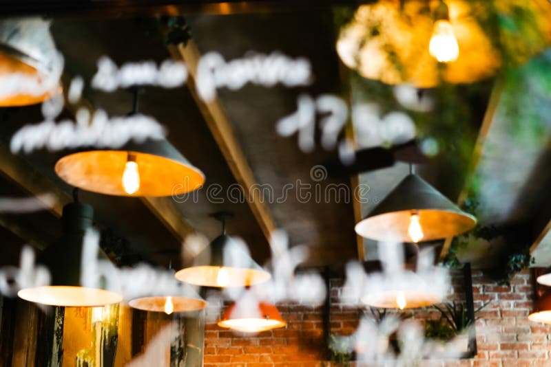 Blurred Reflection of the Ceiling of a Cafe with Beautiful Lamps. Out ...