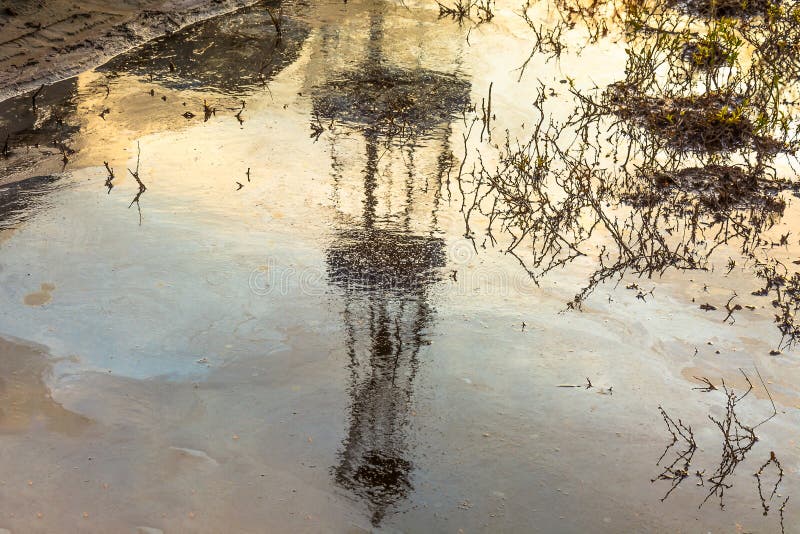 Blurred Reflection of an Oil Rig in a Puddle of Oil. Stock Image ...