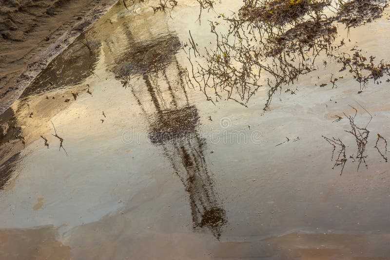 Blurred Reflection of an Oil Rig in a Puddle of Oil. Stock Image ...