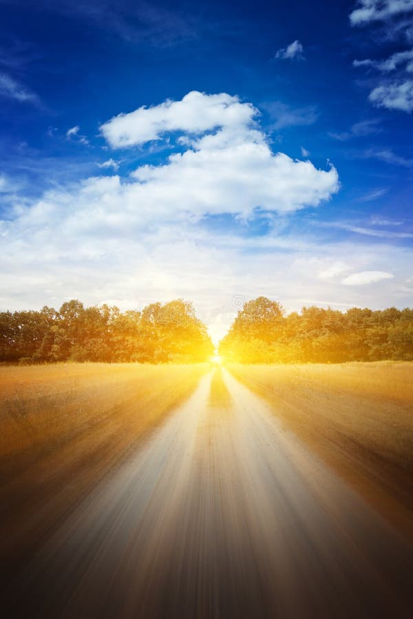 Blurred Road Towards the Setting Sun Stock Image - Image of blur ...