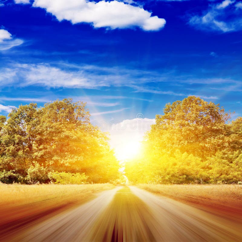 Blurred Road Towards the Setting Sun Stock Image - Image of blur ...