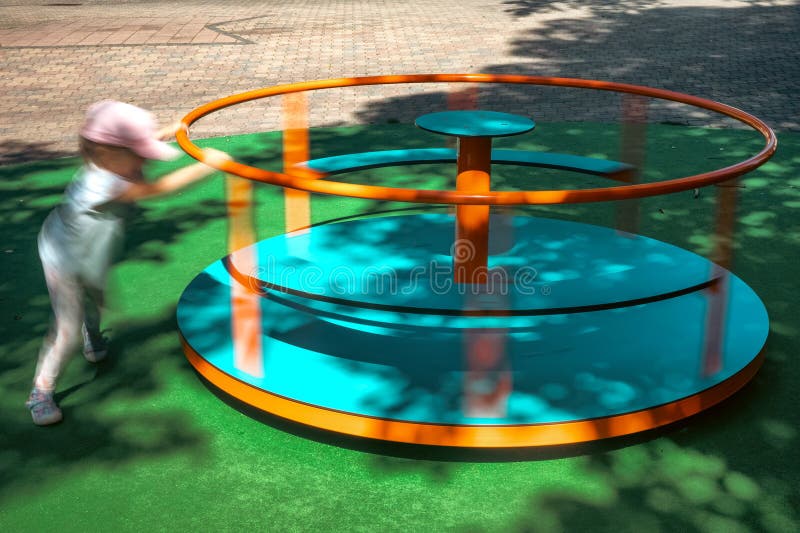 Blurred Small Children Playing with Swing on Playground. Long Exposure ...