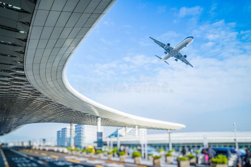 Blurred Street Scene in City with a Plane Flying Over Stock Image ...