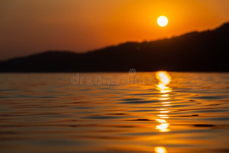 Blurred Sunset at Sea Level Stock Image - Image of sunlight, blue: 58707745