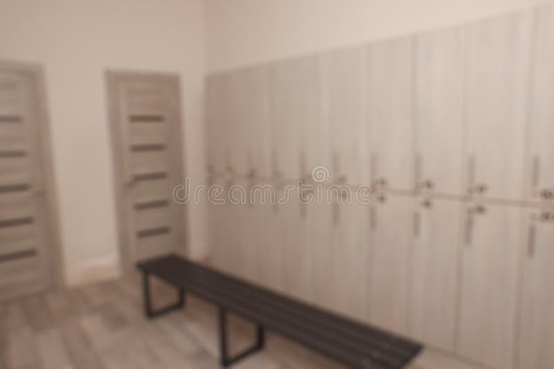 Blurred View of Changing Room with Bench and Lockers Stock Photo ...