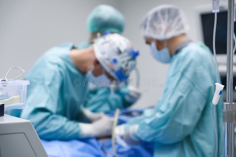 View of Doctors Operating Patient in Surgery Room Stock Photo - Image ...