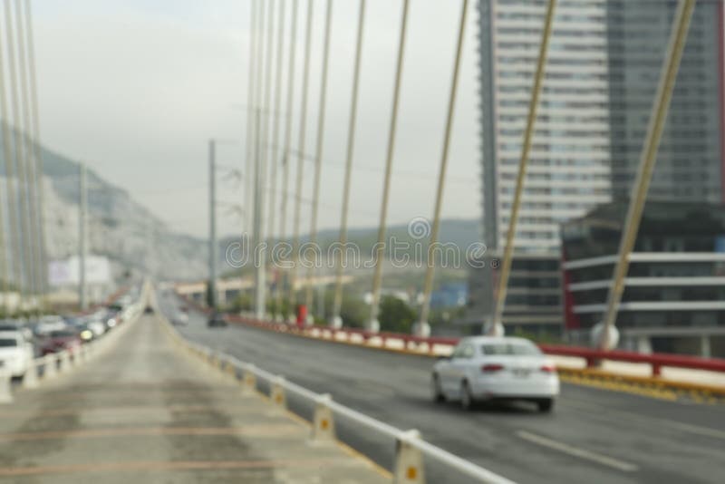 Blurred View of Modern Bridge and Cars Near Mountain Stock Image ...
