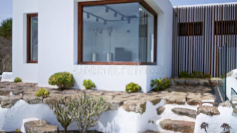 Blurred View of a Modern House Exterior with Succulents in the ...