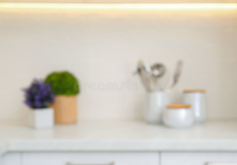Blurred View of Kitchen with Utensils and Houseplants Stock Photo ...
