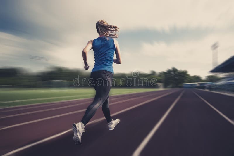 Blurred View of Running Girl on Stadium at Competition. Use As ...