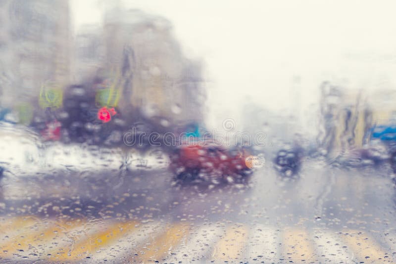 Blurred View through the Windshield of a Car with Raindrops at a ...