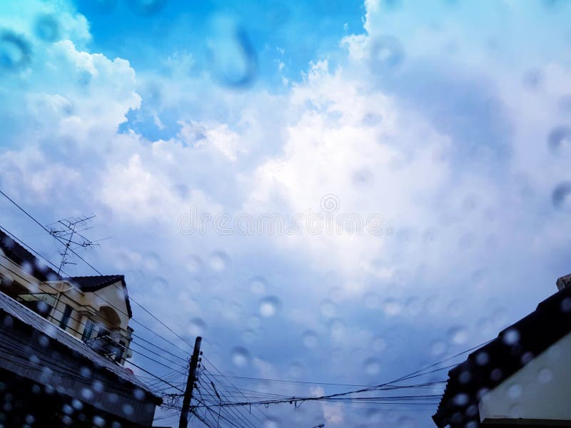 Blurred Water Droplet or Raining on Glass with Building, Electrical ...