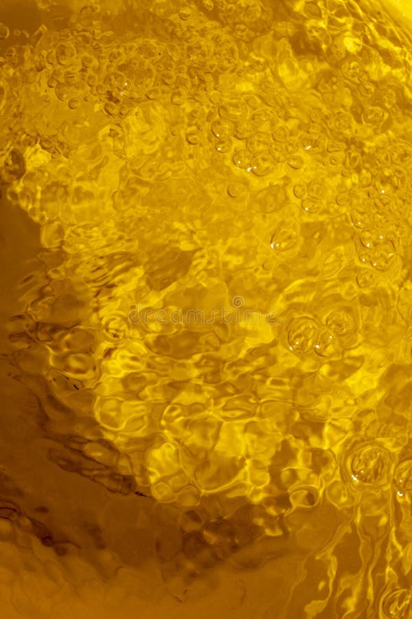 Yellow Abstract Background of Reflection of Running Water with Bubbles ...