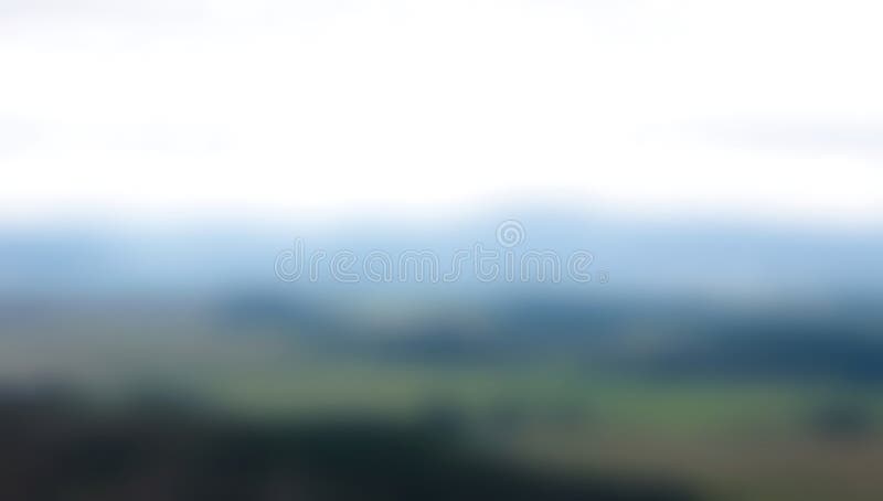Blurry Landscape Showing Distant Mountains and Fields Stock ...