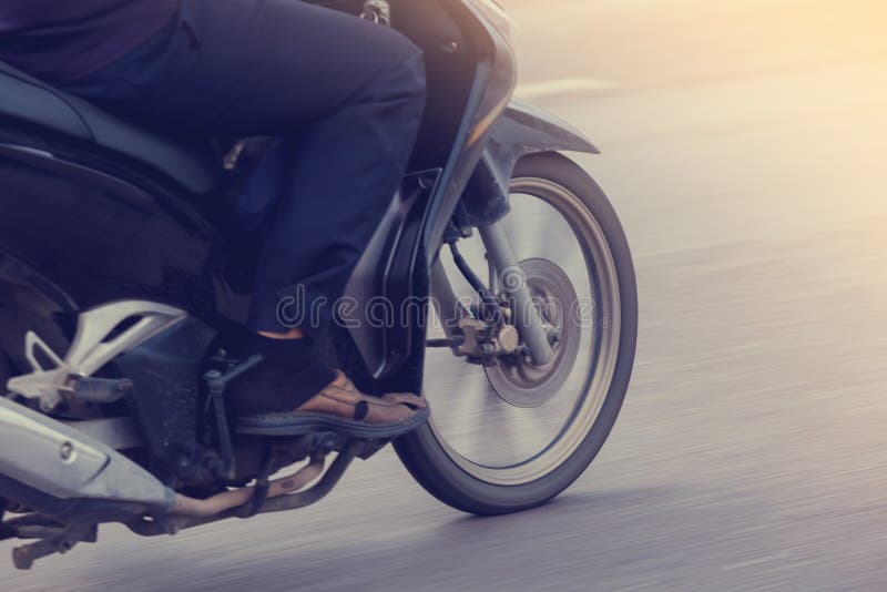 Blurry of Motorcycle Wheel Rotating with Man Driving High Speed Stock ...