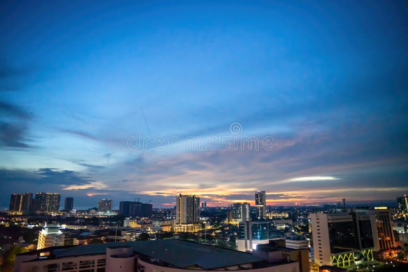 Blurry Panoramic View of City Skyline, Traffic and Light during Sunset ...