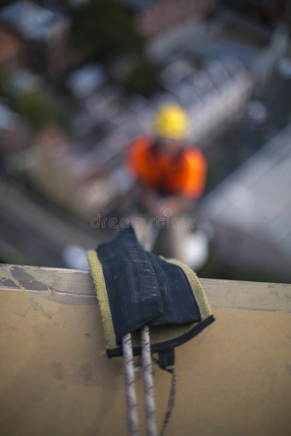 Blurry Rope Access Abseiler Worker Abseiling Down by Using Safety Ropes ...