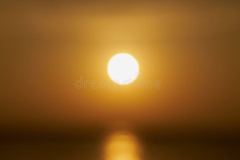 A Blurry Sun Rising Over the Sea at Dawn. Stock Photo - Image of view ...