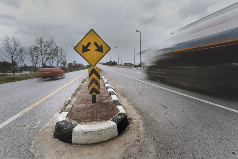 Blurry Big Truck Running through Temporary Condition Road Warning Signs ...
