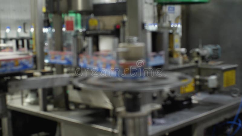 Blurry Video of the Machine Working on the Label Sticker on a Plastic ...