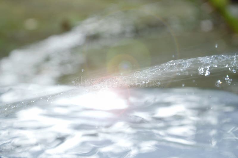Blurry Water Flow and Splashing with Sunlight in Garden Stock Image ...