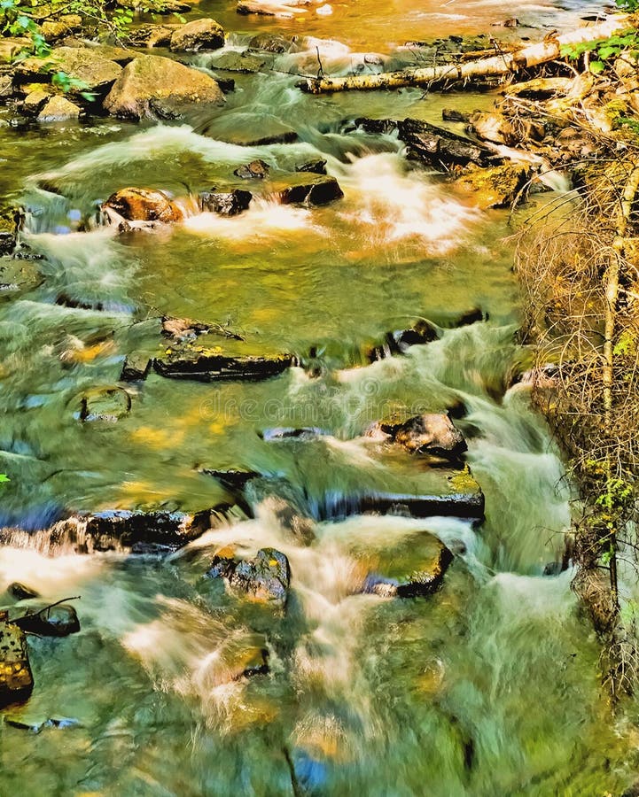 A Blurry Water Stream among Rocks Stock Image - Image of flower ...