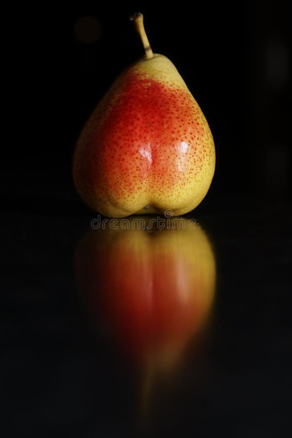 Blush Pear Reflection on Black Granite Stock Photo - Image of blush ...