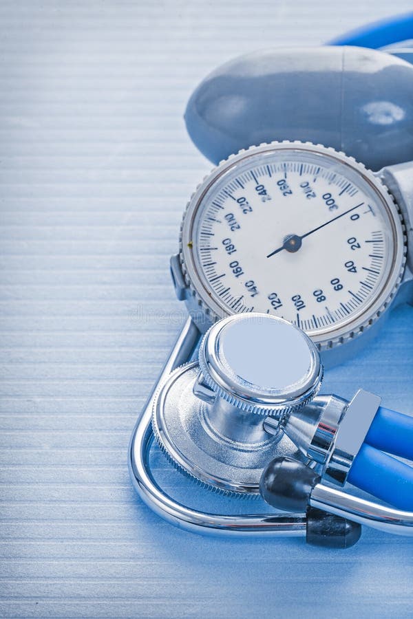 Bluud Pressure Monitor and Stethoscope on Blue Stock Photo - Image of ...