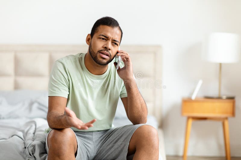 Black Man Talking on Phone with Confused Look Stock Image - Image of ...