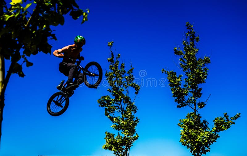 Bmx Rider Jumping High on a Blue Sky Stock Photo - Image of show, bike ...