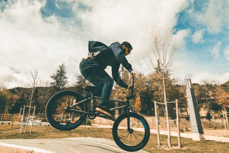 BMX Rider Making Tricks .Guy Riding a Bmx Bike Stock Image - Image of ...