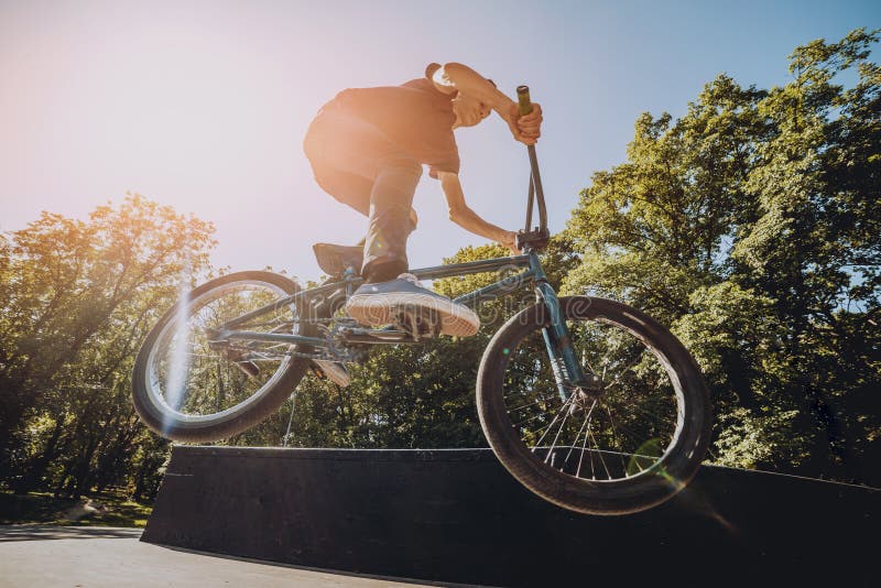 Bmx Rider Performing Tricks at Skatepark. Background. Stock Image ...