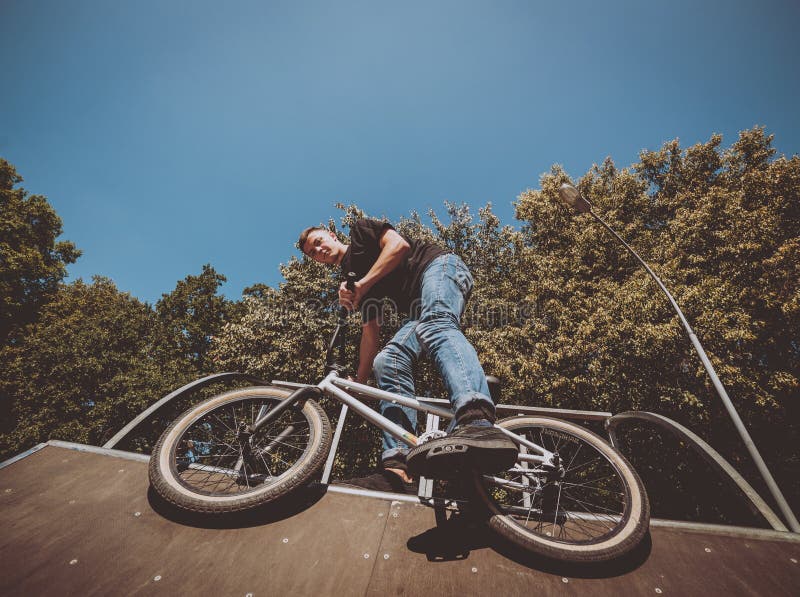 Bmx Rider Performing Tricks at Skatepark. Background. Stock Photo ...